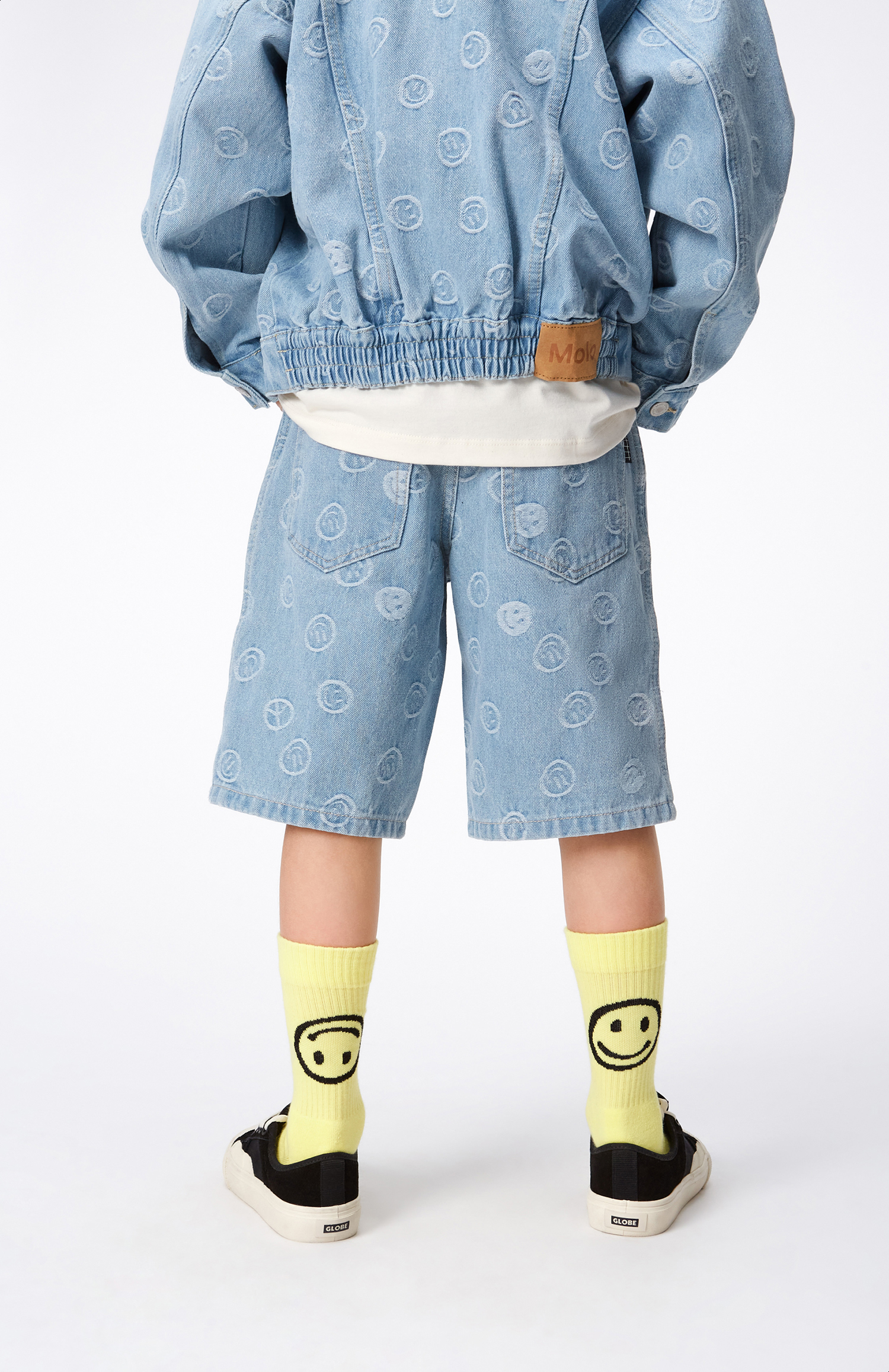 Art - Happiness Light - Knee length denim shorts with smiling faces ...