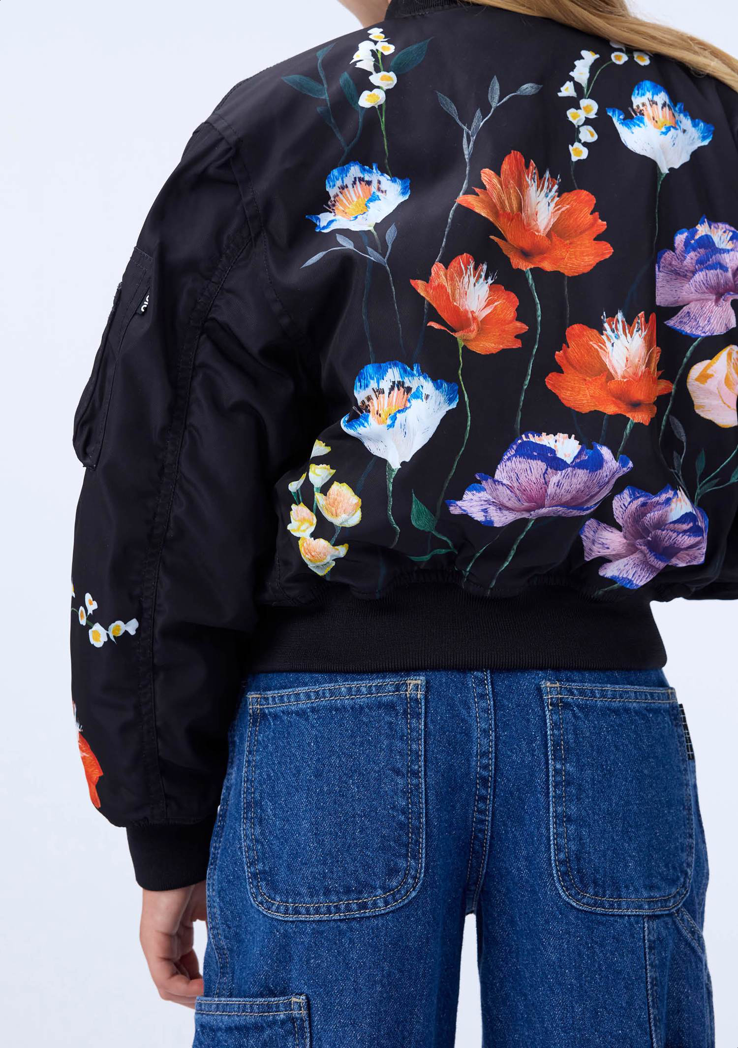 Hedia - Paper Flora - Black bomber jacket for children with a colourful floral print made from ...