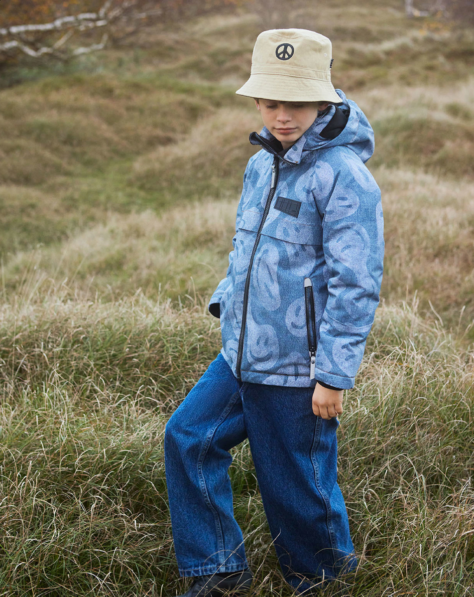 Castor - Denim Swirley - Recycled winter jacket in blue with faces - Molo