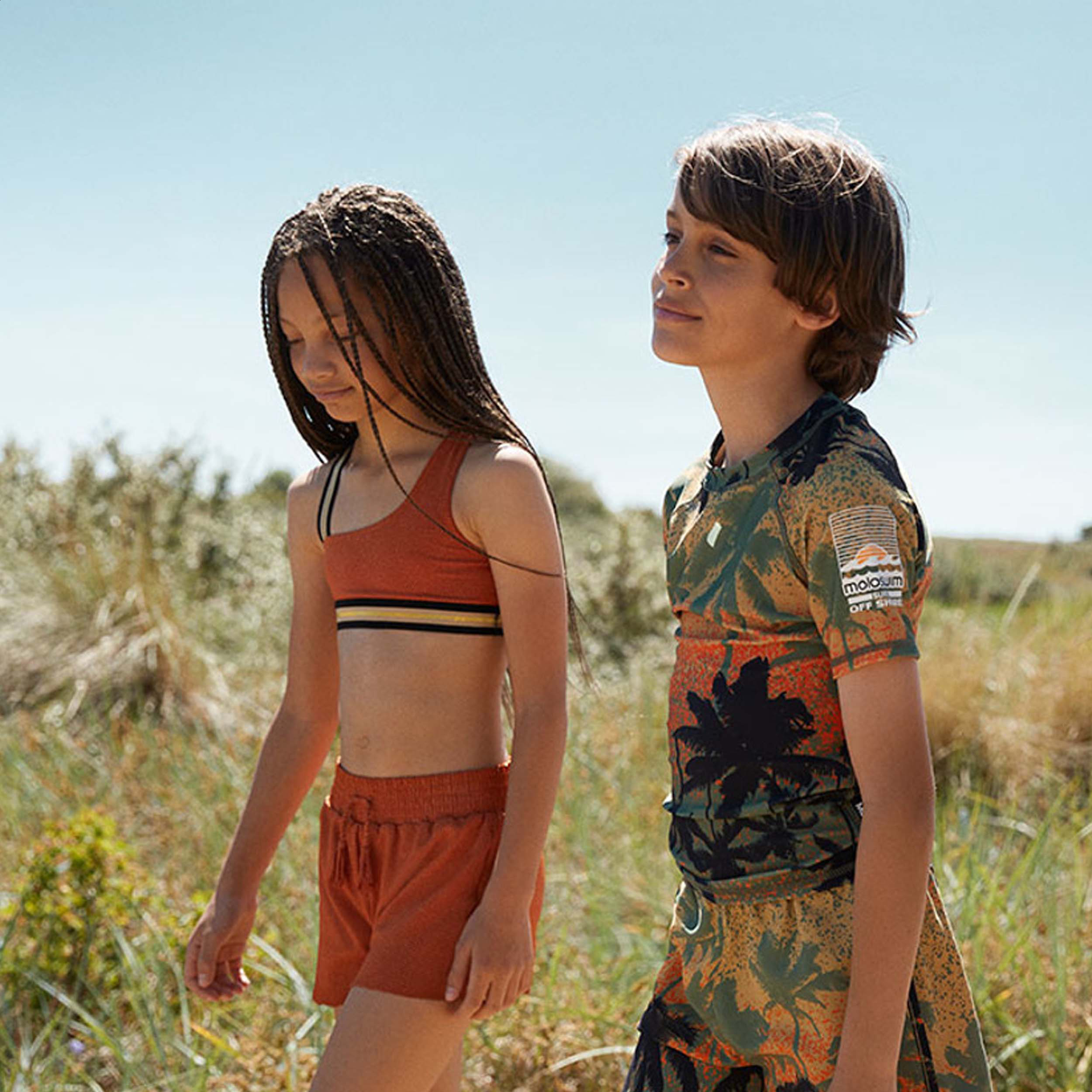 Nicola - Rusty - UV asymmetrical bikini in rust red gold details - Molo